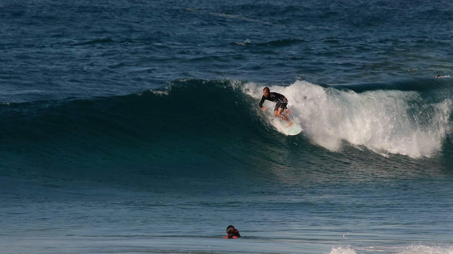 Surfing 101: How To Duck Dive and Paddle Efficiently - Surfer