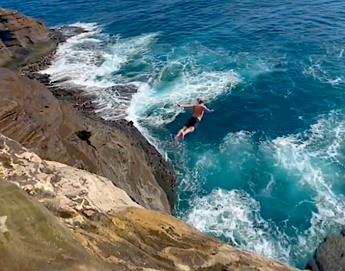 Maniac Jumps 70ft Hawaii Cliff, Near-Death Experience (Video) - Surfer