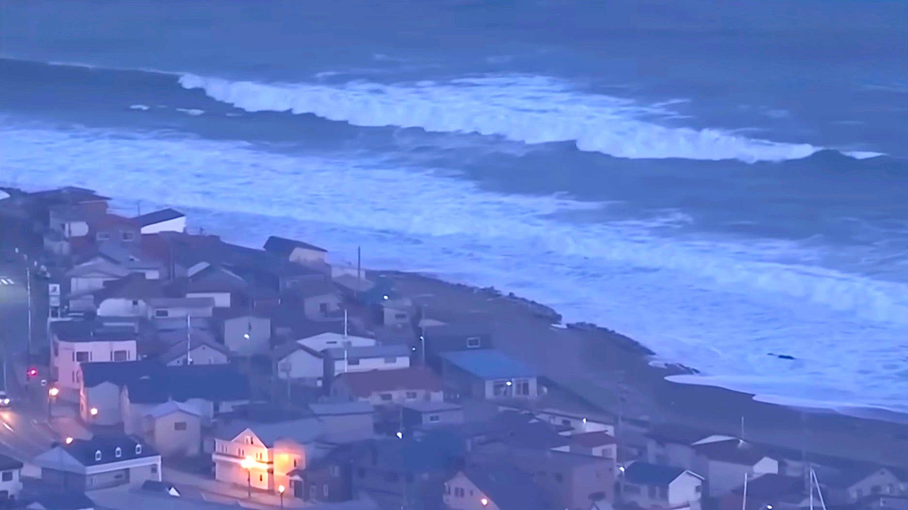 Watch: Tsunami Waves Slam Japan Following 7.7 Earthquake - Surfer