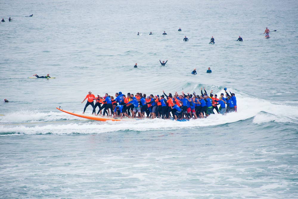 One Giant Board, Two World Records | SURFER Magazine - Surfer