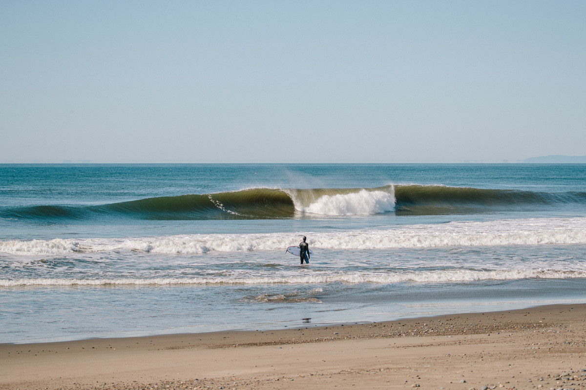 Empty Surfboard On Wave