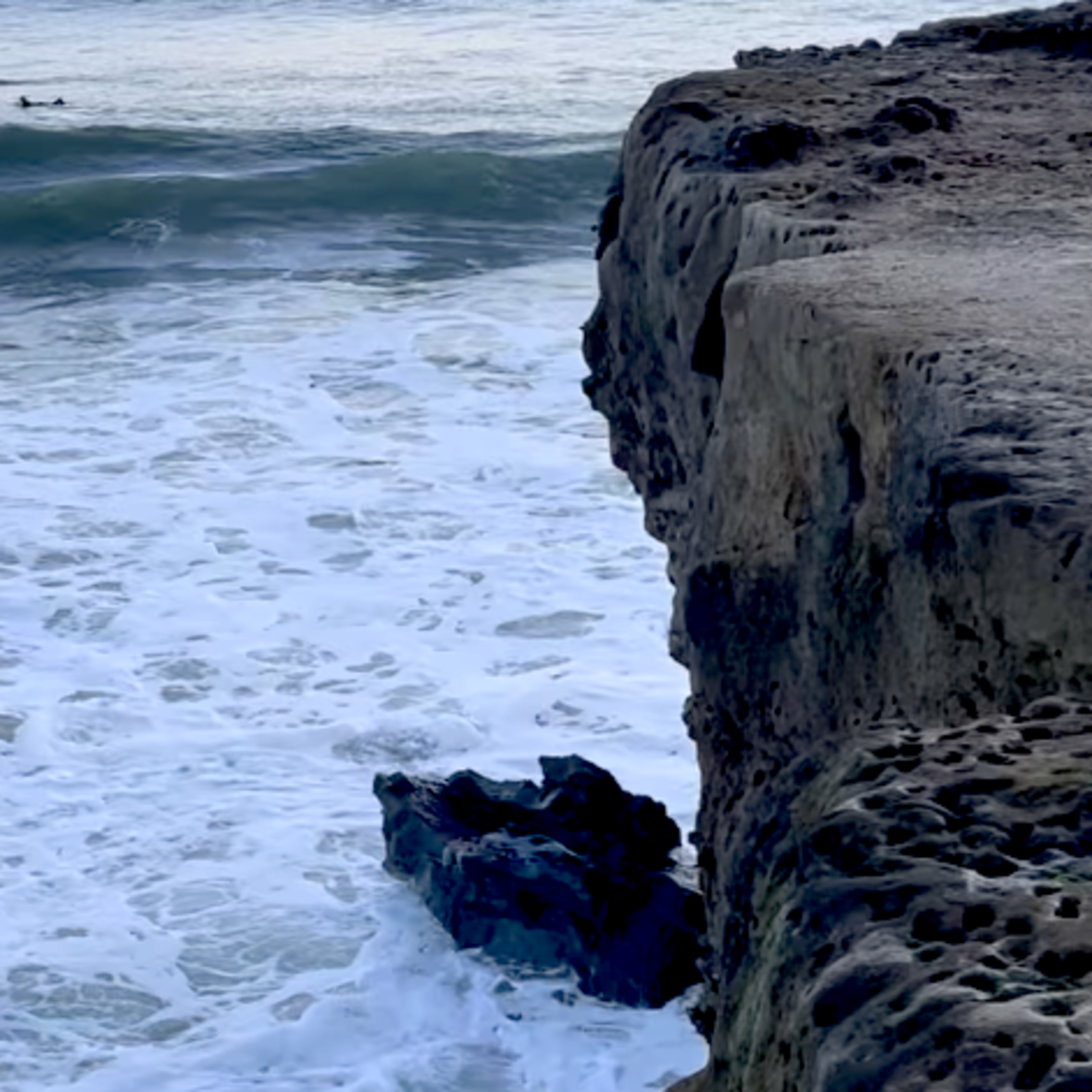 waves crashing into cliffs
