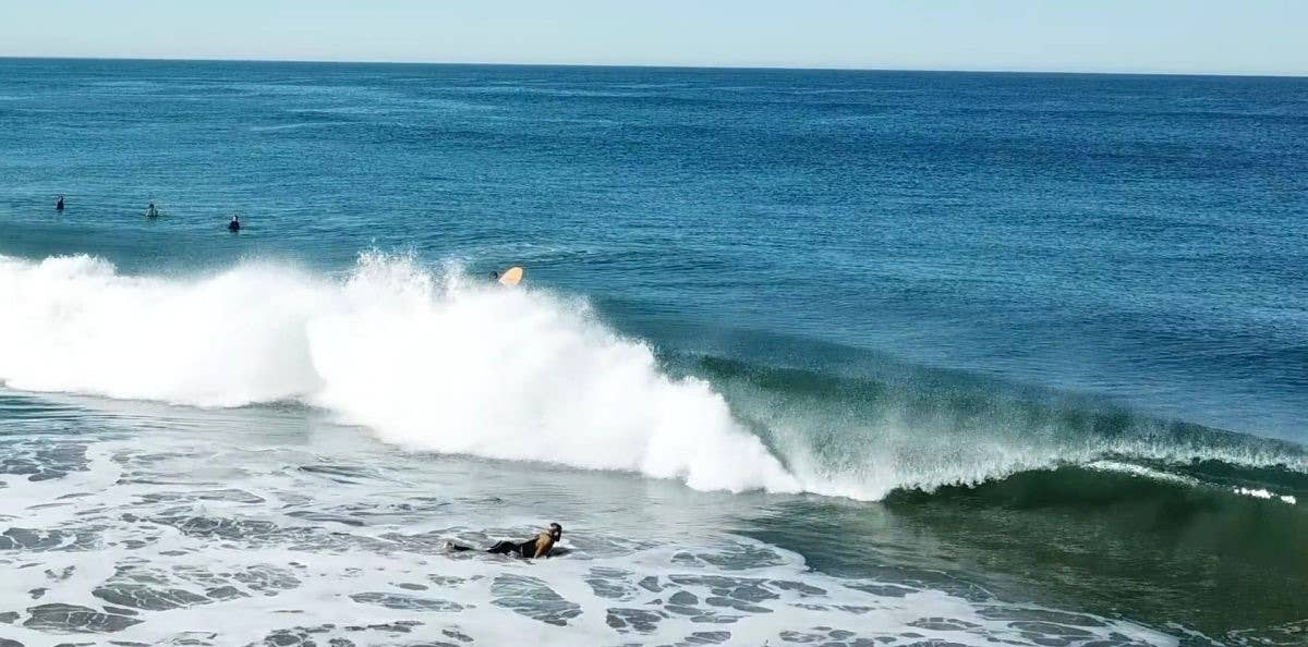 Surfing 101: How To Duck Dive and Paddle Efficiently - Surfer