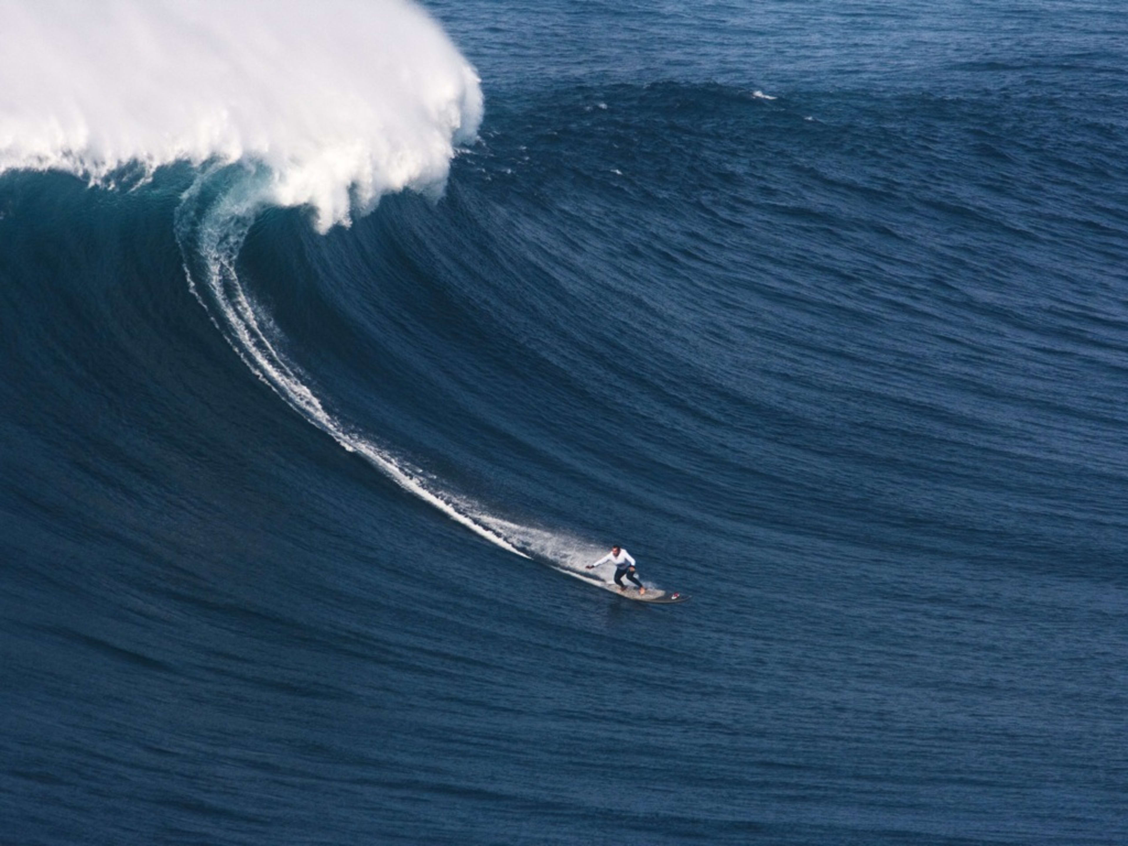 Garrett McNamara Surfs Giant Wave On A WaveJet Propelled Gun - Surfer