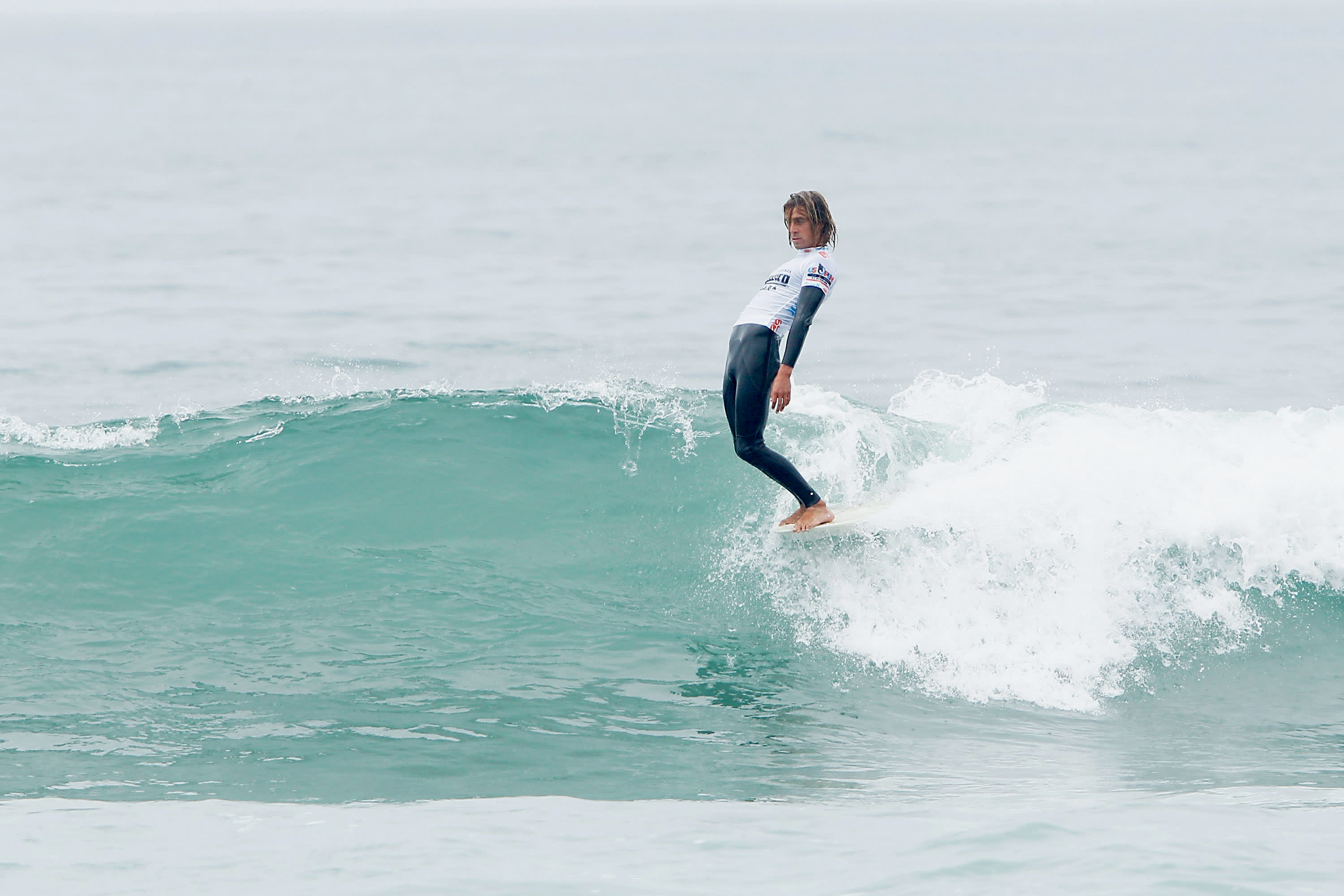 Surfing Lingo 101: What Does It Mean To Hang Ten? - Surfer